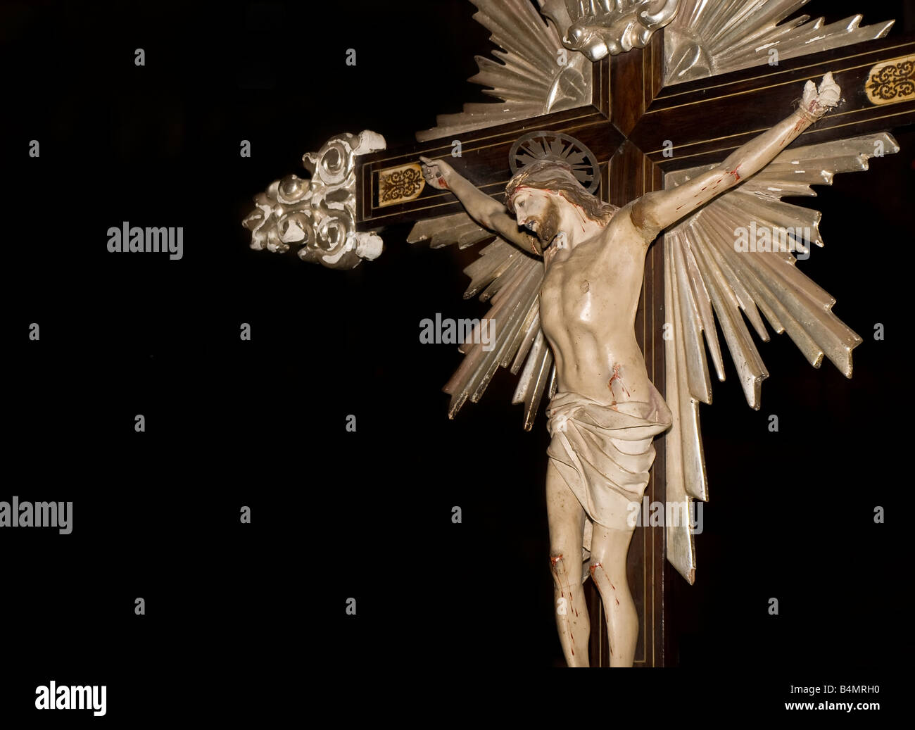 Medieval crucifix with intricate detailing carried during a procession ...