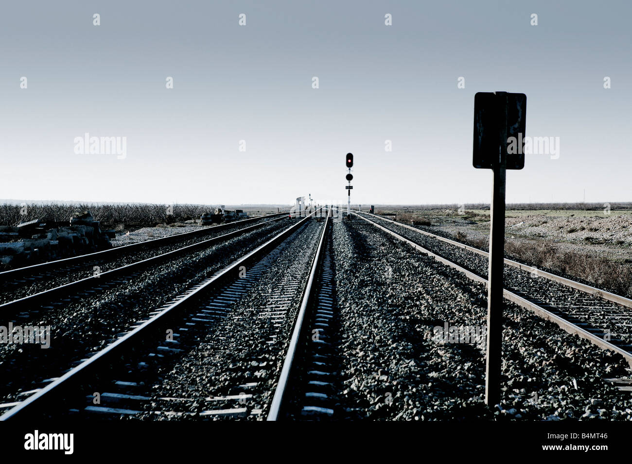 An empty railway track with sign in foreground Stock Photo - Alamy