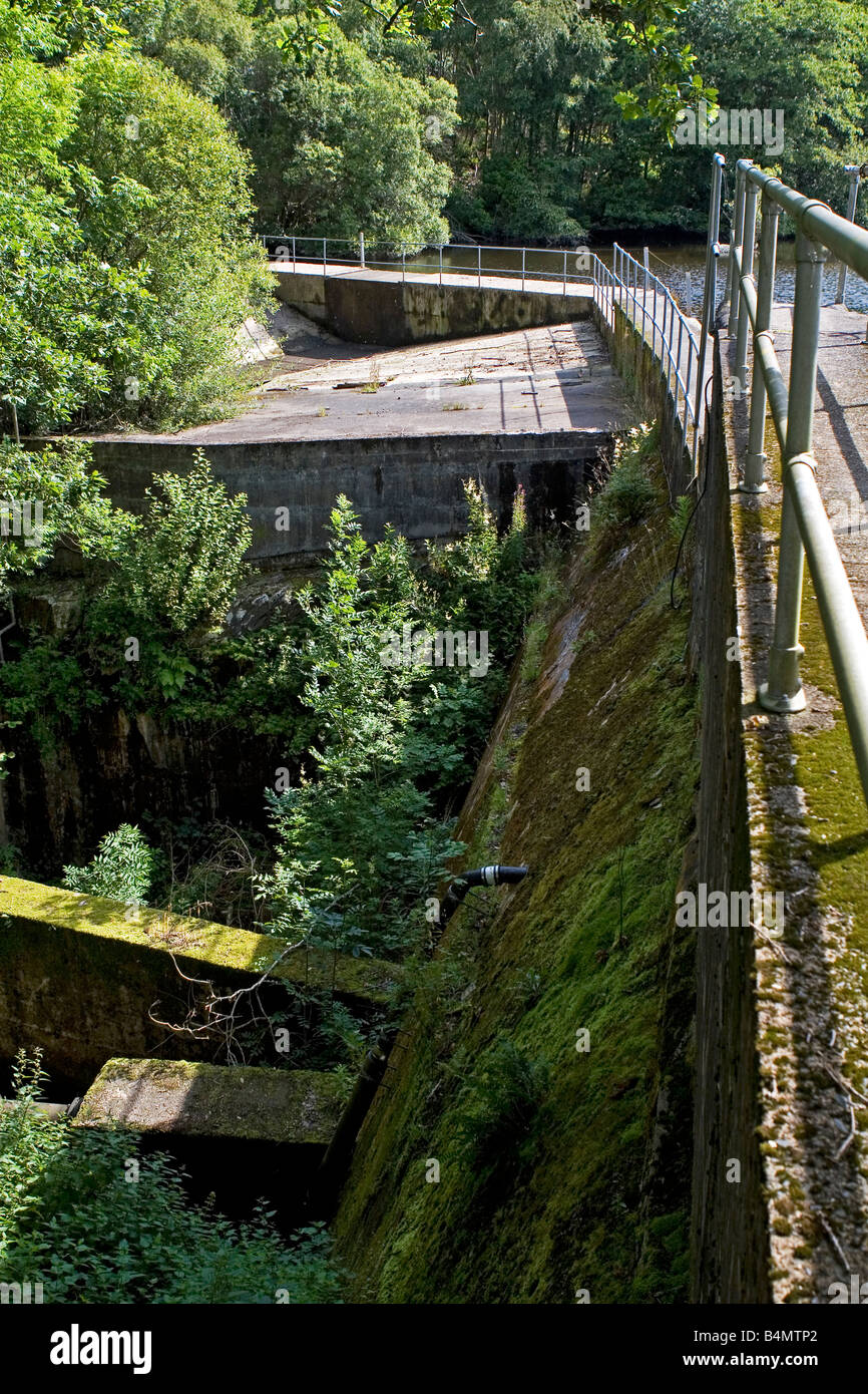 Outfall and weir from reservoir with water going to small scale hydro ...