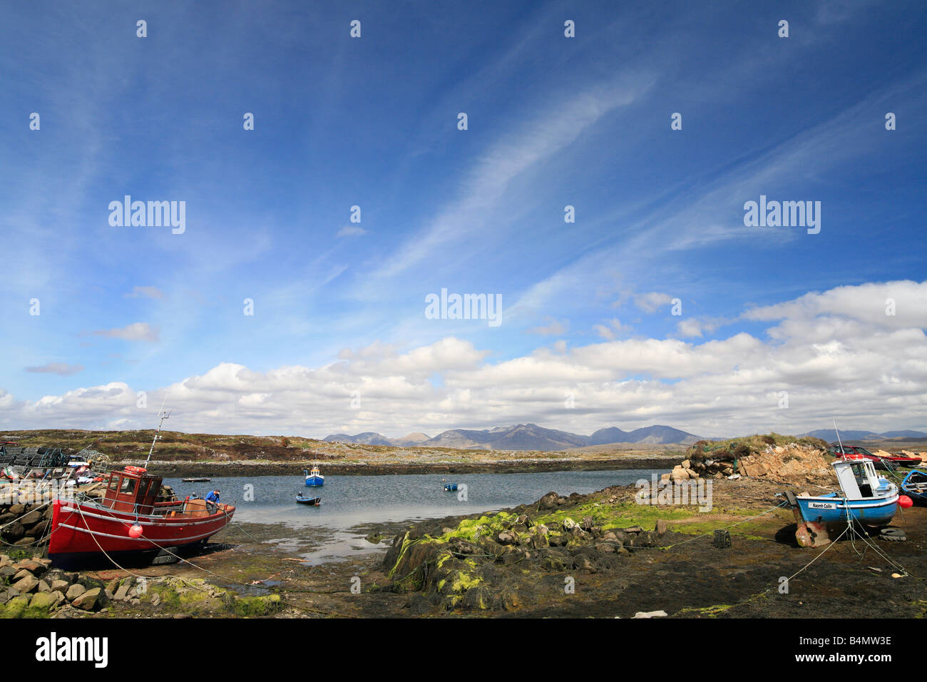 colourful old fishing boats on Inishnee an island near Roundstone ...