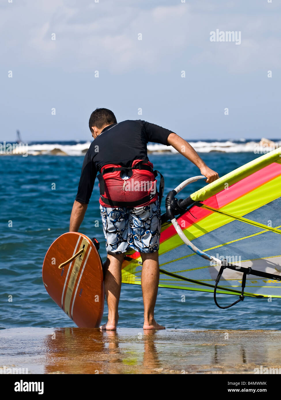 A young man getting ready to hit the waves Stock Photo - Alamy