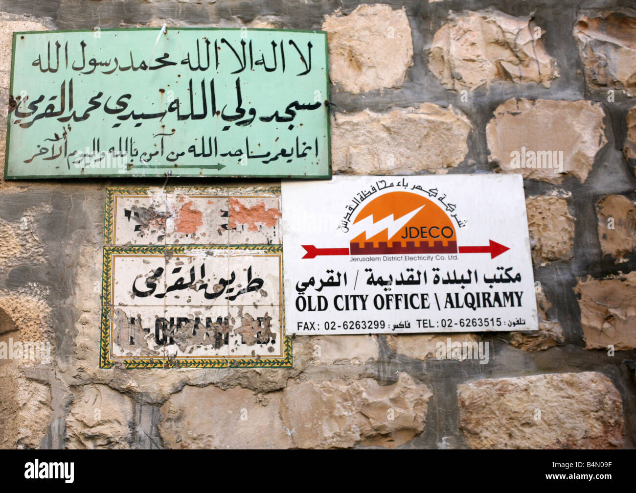 Arabic signs hang in a market in the old city section of Jerusalem ...