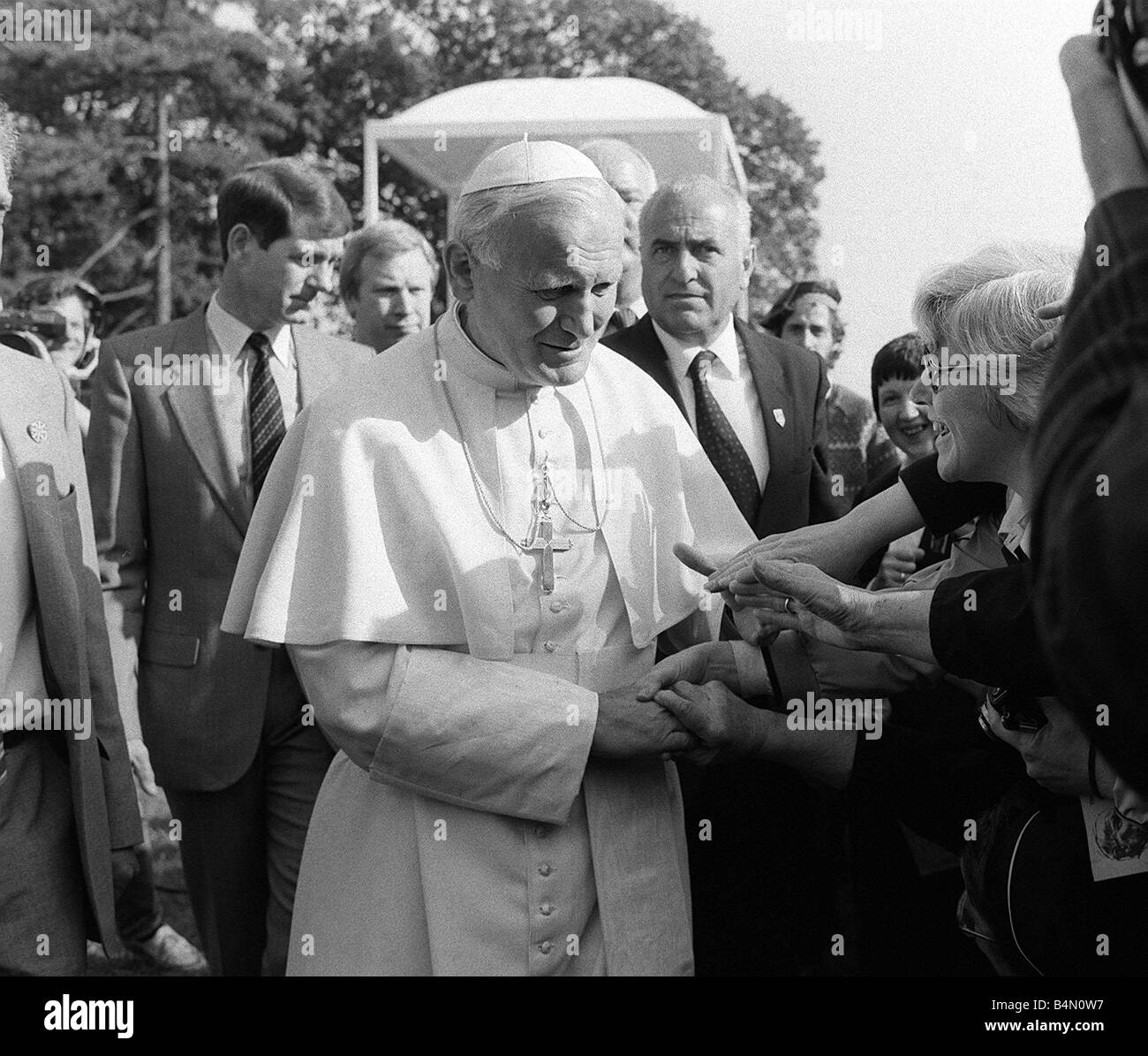 Pope John Paul II during his visit to Britain in 1982 walks among the ...