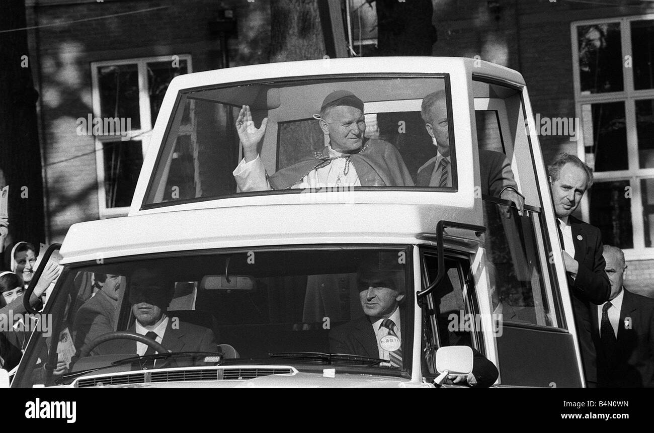 Pope John Paul II during his visit to Britain in 1982 rides along in ...