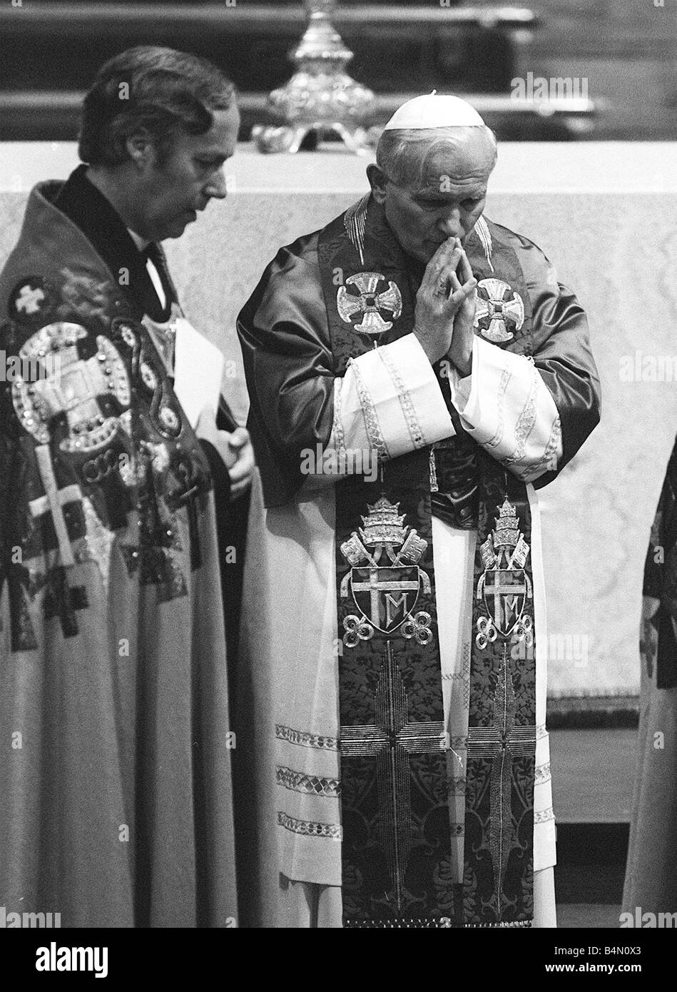 Pope John Paul II during visit to Britain in 1982 in pray at the altar ...