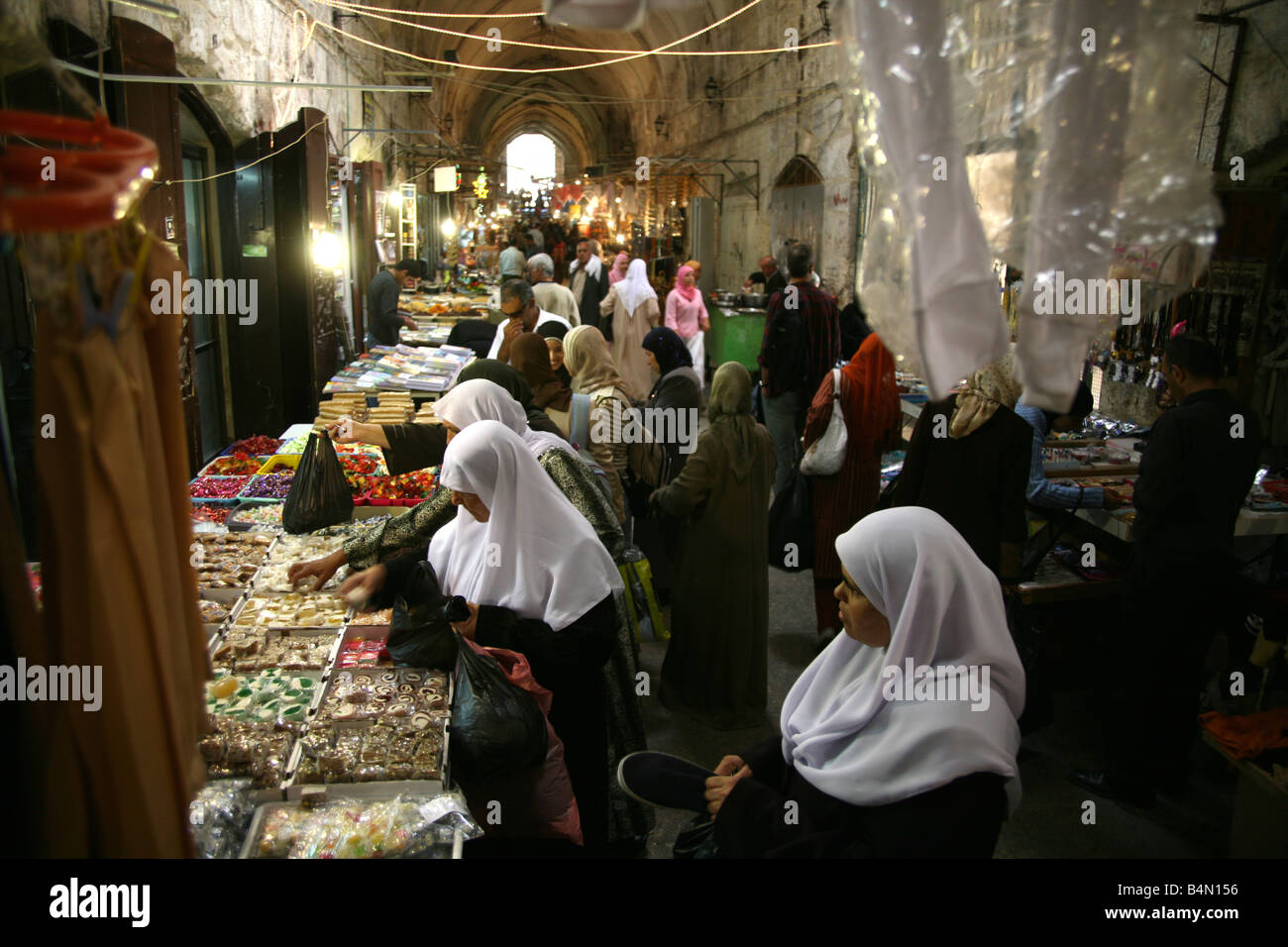 Women buy sweets at a market in the old city section of Jerusalem Stock ...