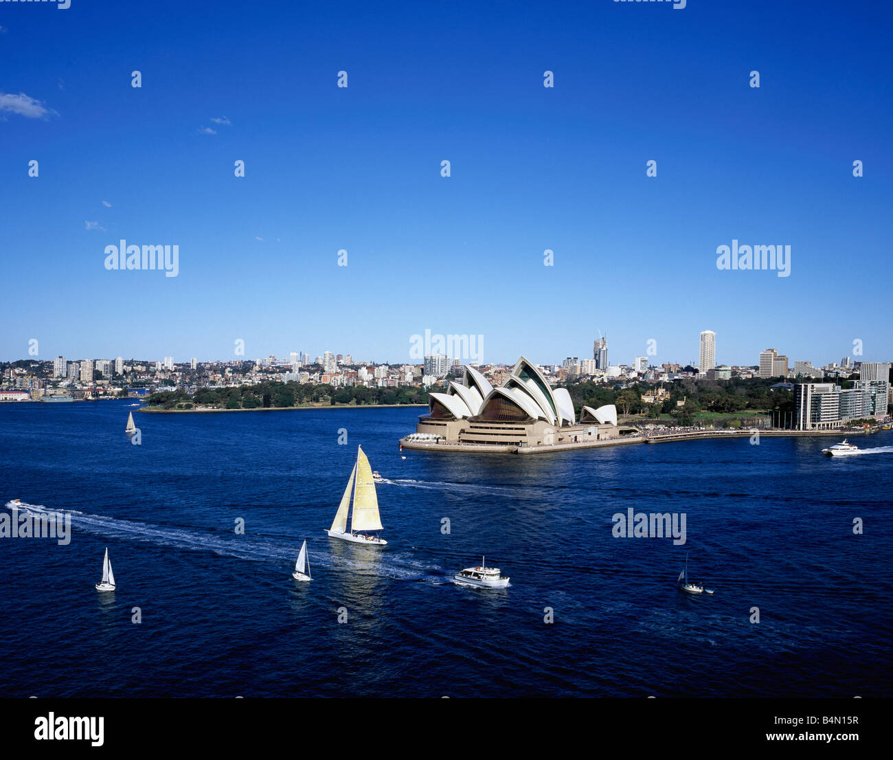The opera House with sailing and small ferry boats Stock Photo - Alamy
