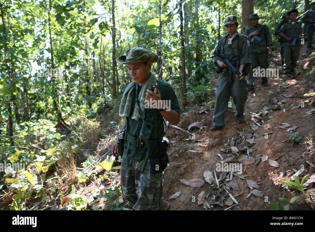 KNLA soldiers walking through the jungle near Thailand In Myanmar Burma ...