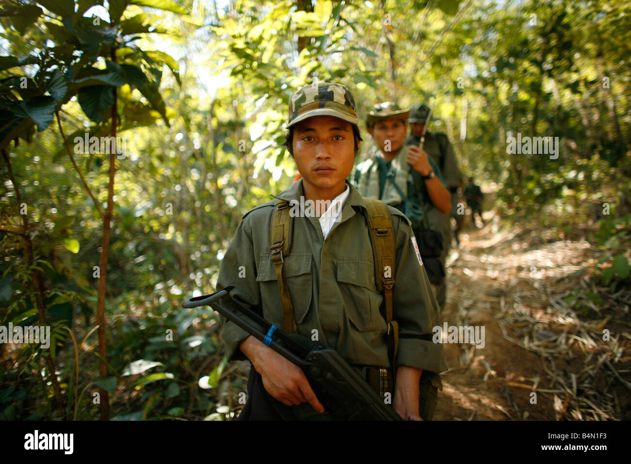 KNLA soldiers walk through the jungle In Myanmar Burma thousands of ...