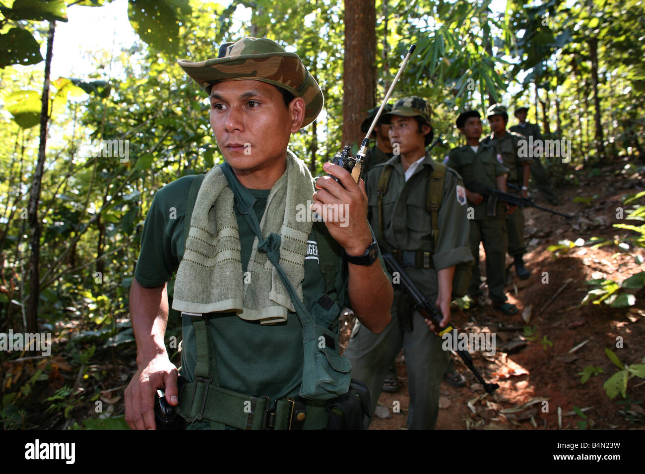 A KNLA soldier listening to a radio device near the border with ...