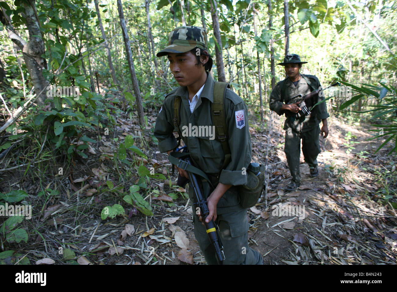 KNLA soldiers walking through the jungle near Thailand In Myanmar Burma ...
