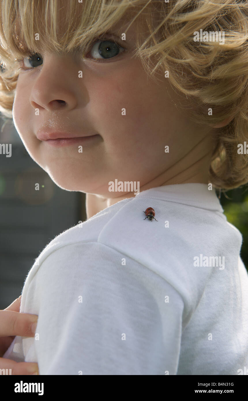 Boy with a ladybird Stock Photo - Alamy