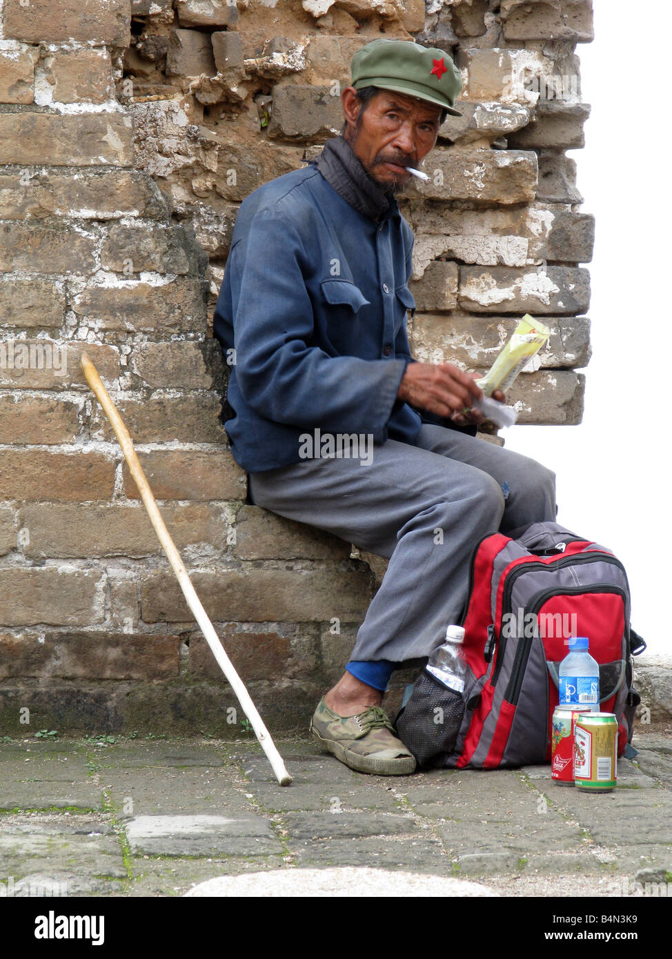 A Chinese native in a Chairman Mao cap on the Great Wall of China Stock ...