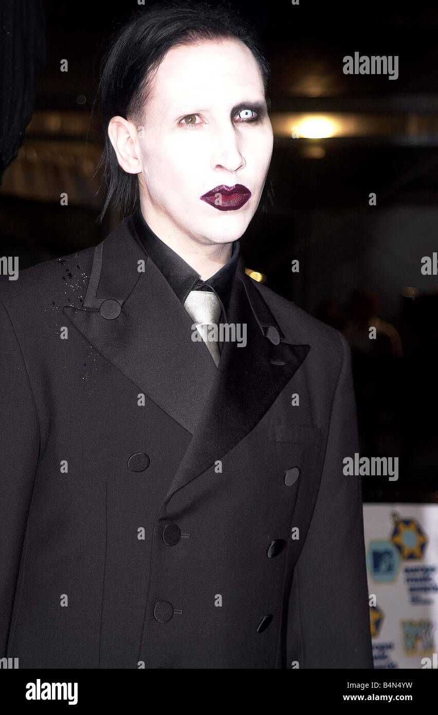 Wearing black suit hi-res stock photography and images - Alamy