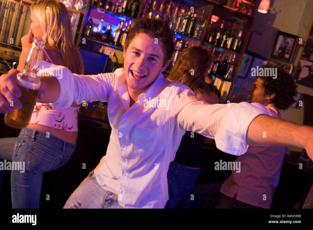 Young man in a bar Stock Photo - Alamy