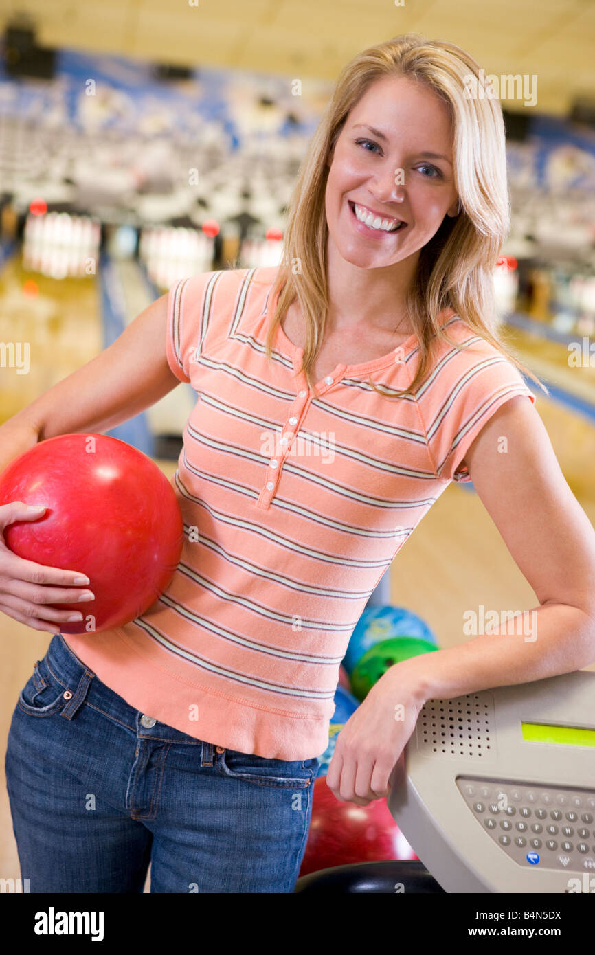 Woman standing at bowling alley hi-res stock photography and images - Alamy