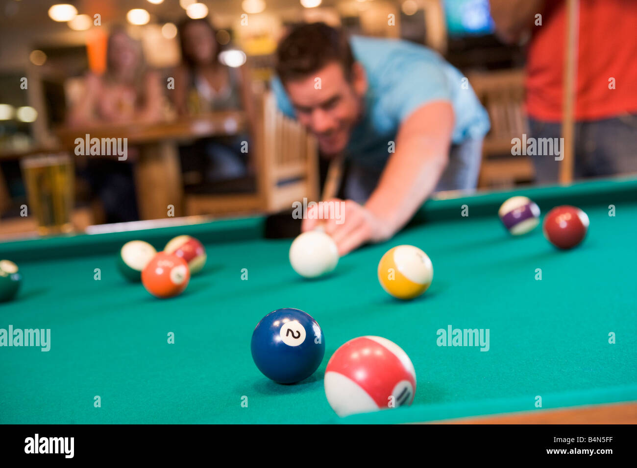 Man playing pool Stock Photo - Alamy