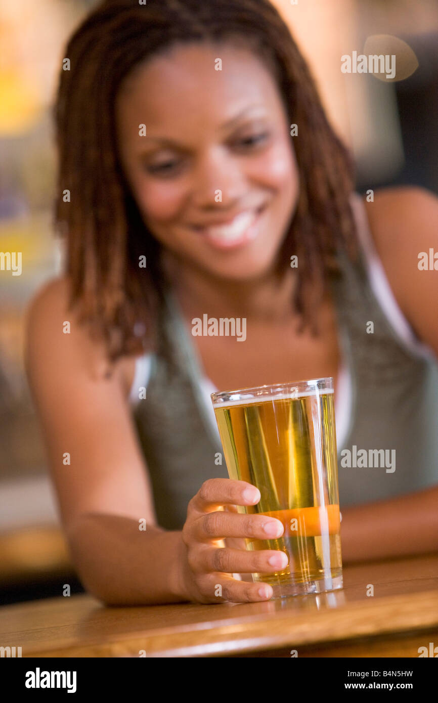 Woman having a glass of beer Stock Photo - Alamy