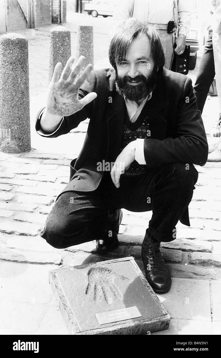 Bill Forsyth film producer making hand impression hand print in paving ...