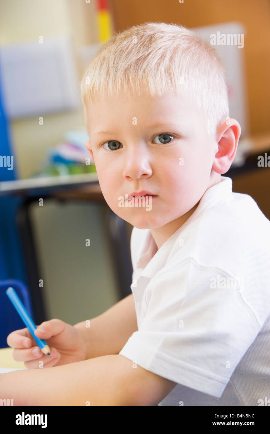 Student in class writing in notebook (selective focus Stock Photo - Alamy