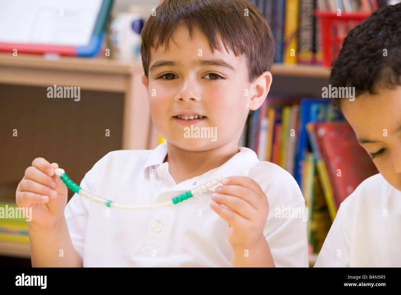 Student in math class with counting beads Stock Photo - Alamy