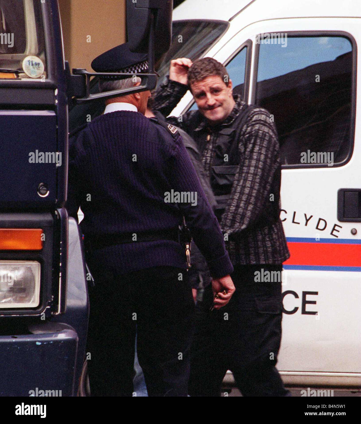 Actor Iain McColl led away from court into police van after he was ...