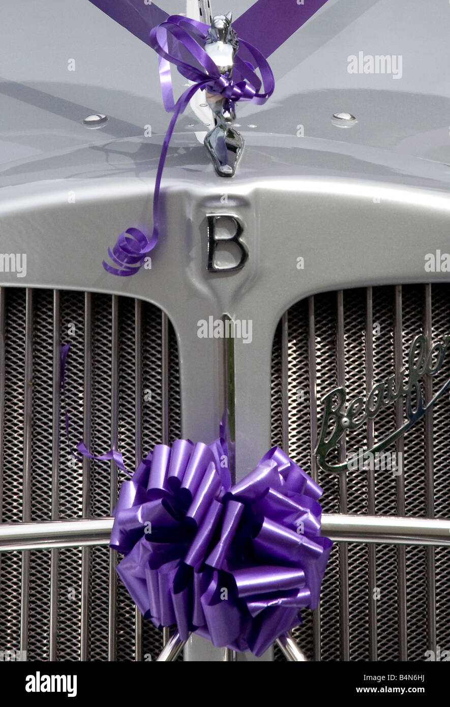 Beauford classic car engine grill with purple wedding ribbons Stock ...