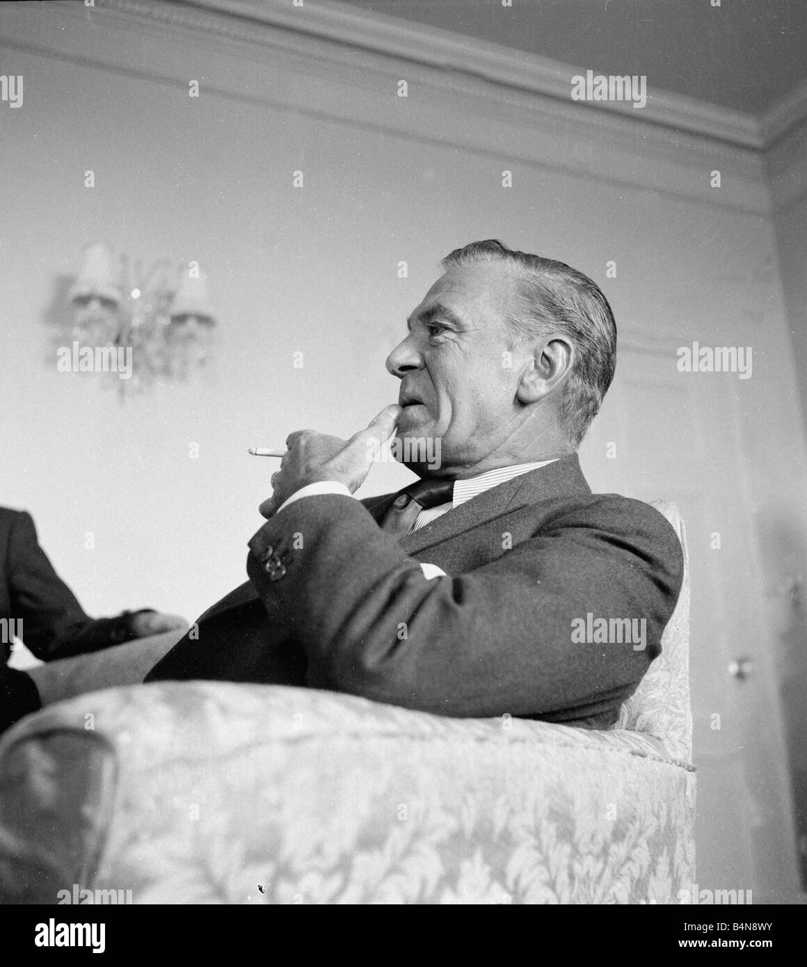 Gary Cooper in London smoking a cigarette April 1955 Stock Photo - Alamy