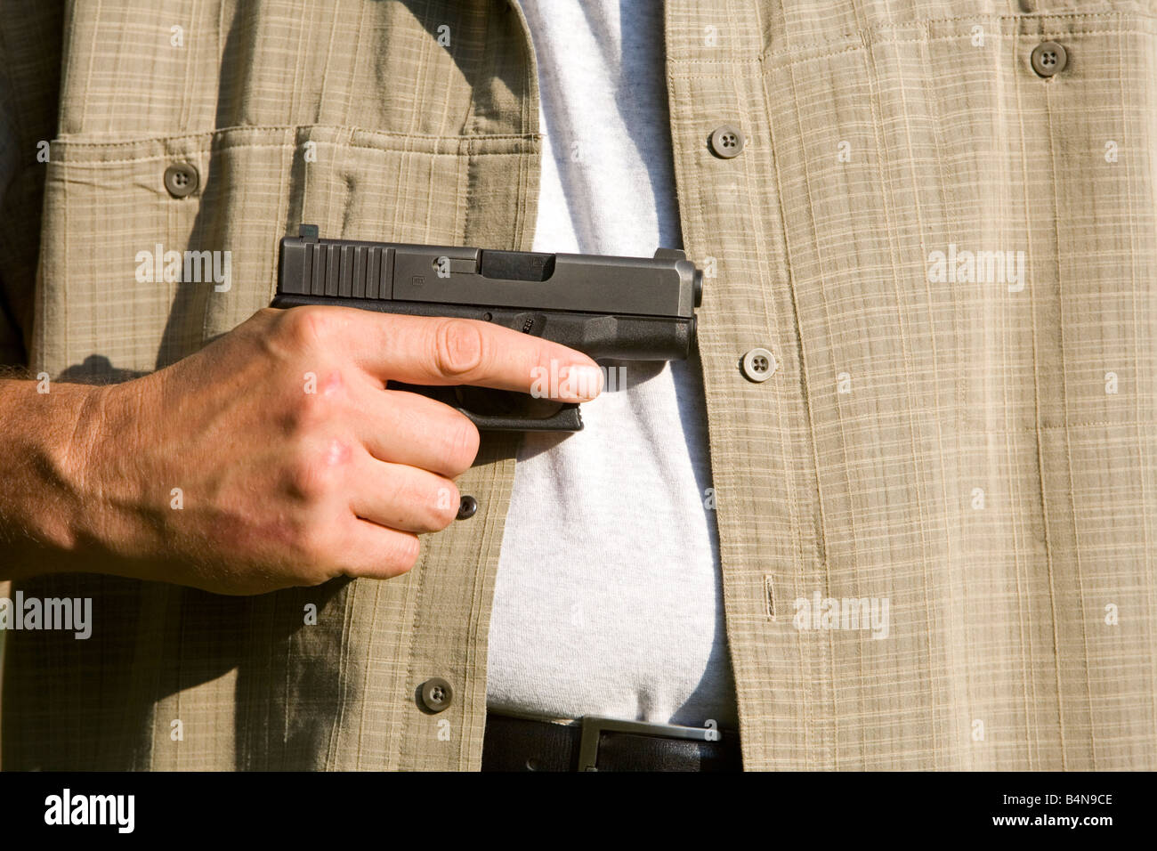 Concealed weapon hi-res stock photography and images - Alamy