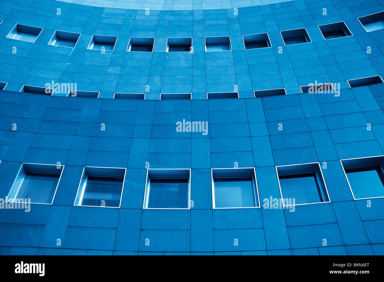 Blue business building with a lot of windows Stock Photo - Alamy