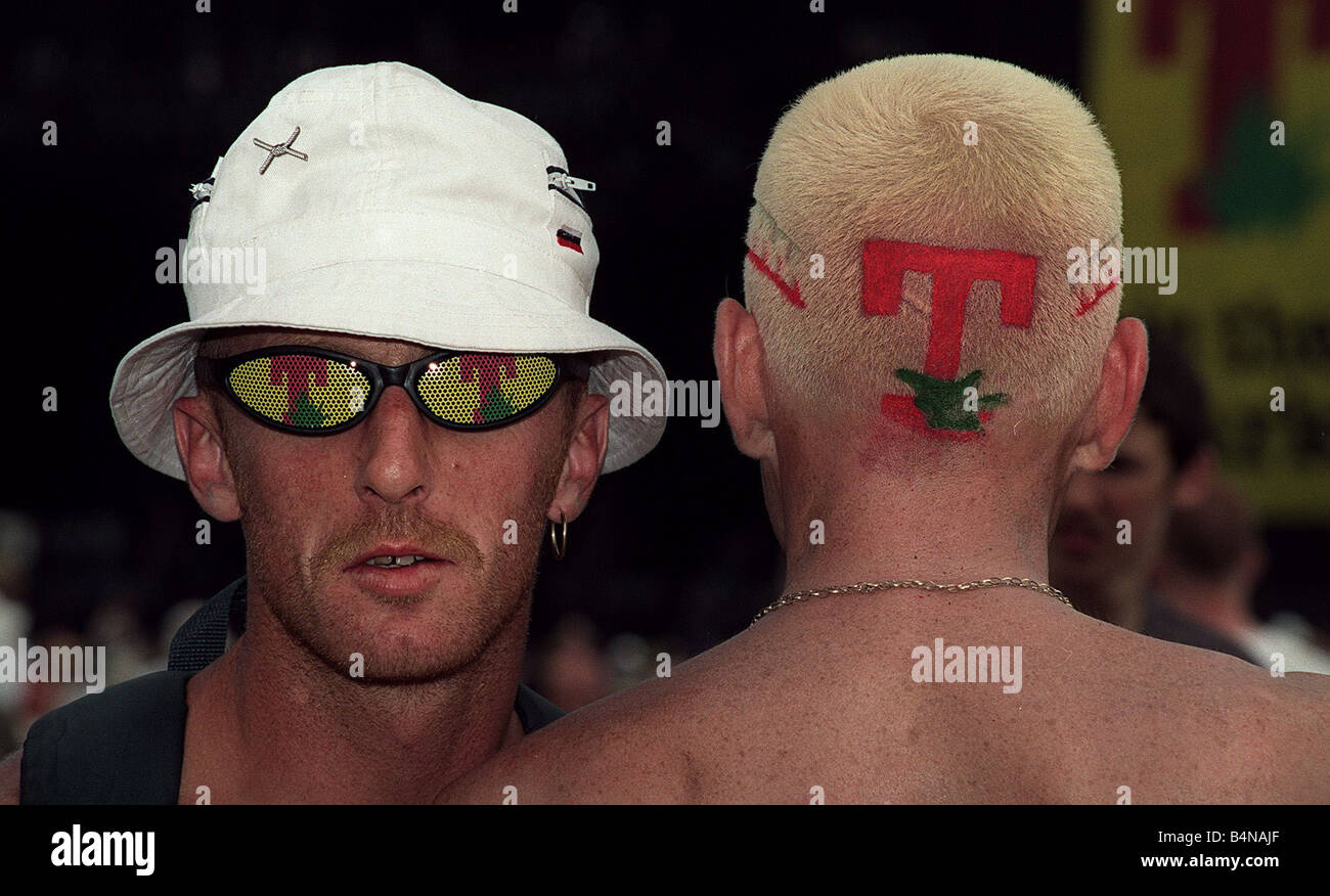 Man with T in the Park logo sunglasses and back of mans head with the T ...