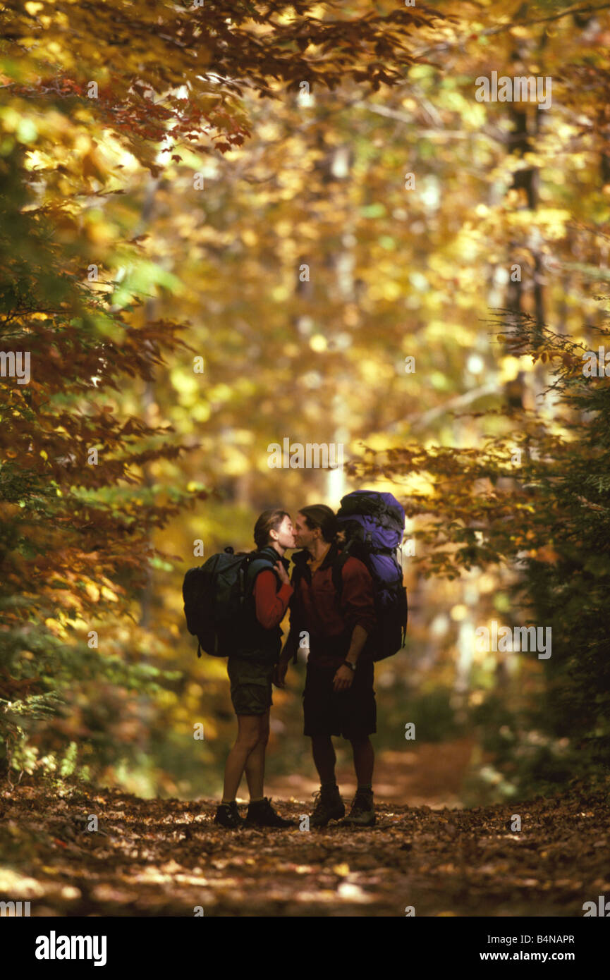 Couple kissing on the trail during a hike Stock Photo - Alamy