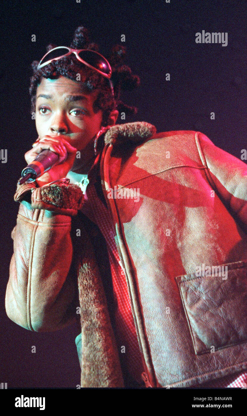 Lauryn Hill 1996 singer with the pop group The Fugees holding ...