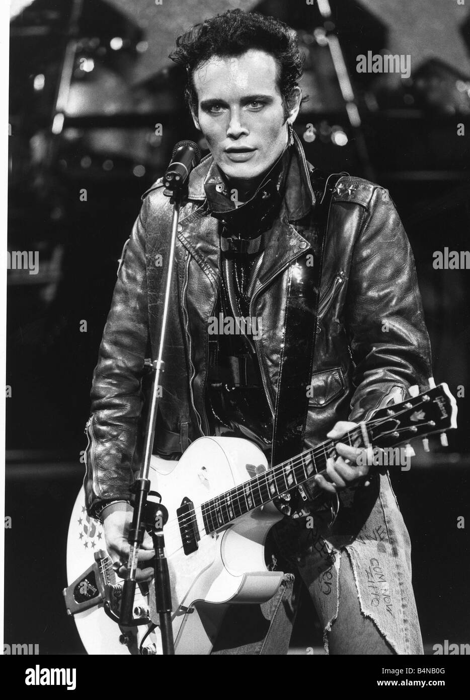 Adam Ant British pop singer playing guitar on stage 1985 Stock Photo ...