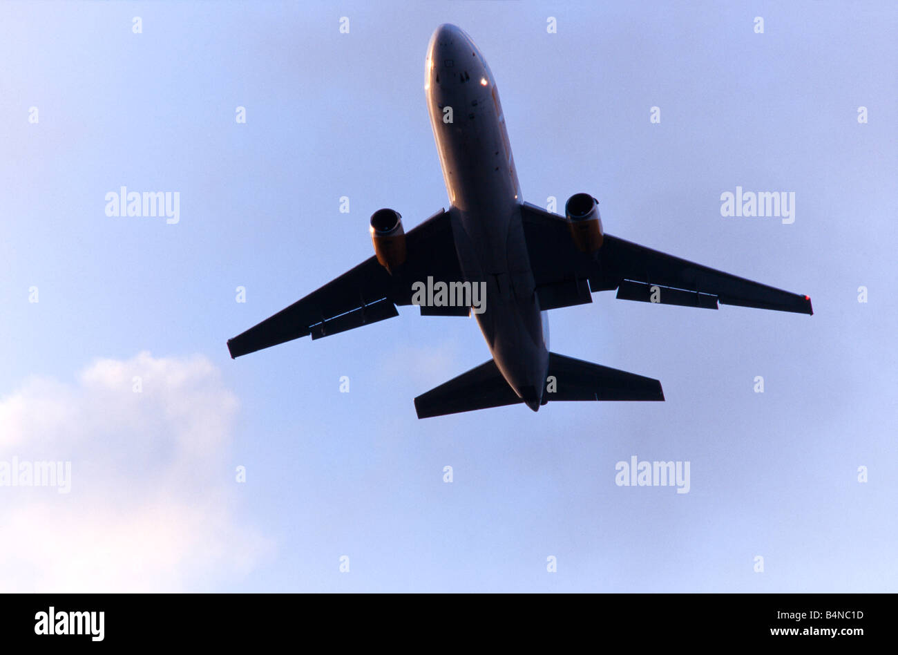 Commercial Airliner taking off, dramatic cloud filled skies Stock Photo ...