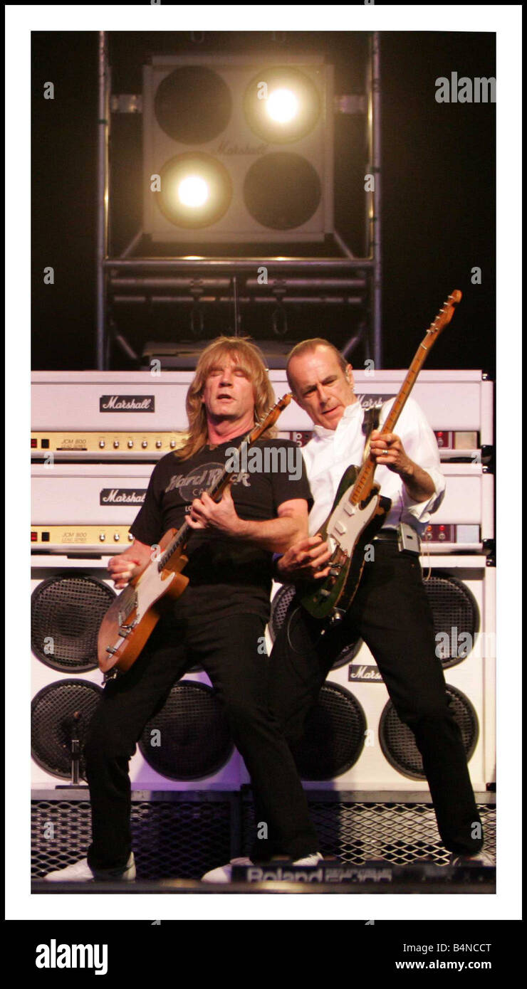 Veteran Rockers Status Quo demonstrate their skills on the guitar Stock ...