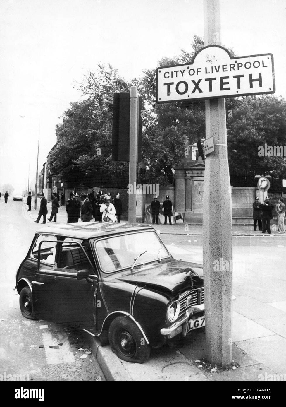 A wrecked car at the Toxteth boundary July 1981 in Liverpool following ...