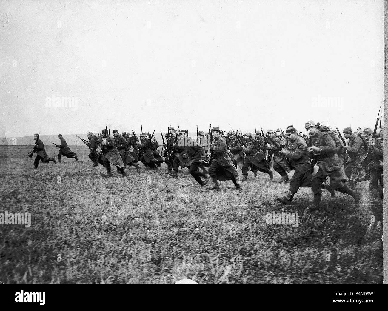World War I French Soldiers charge across a field with rifles raised ...