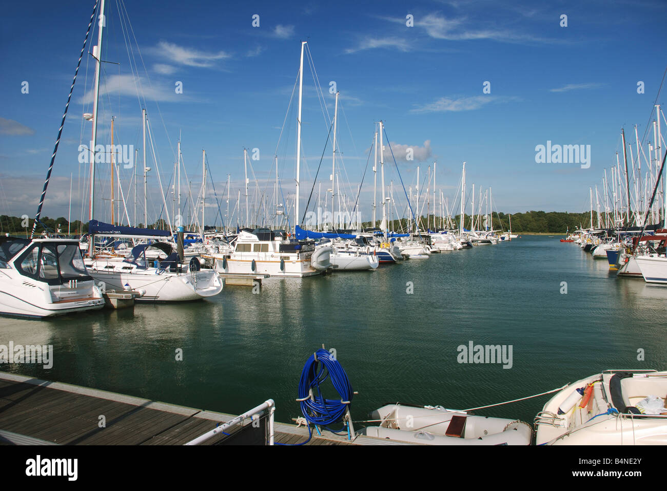 Yachts lined up along pontoon at marina on the river Hamble ...