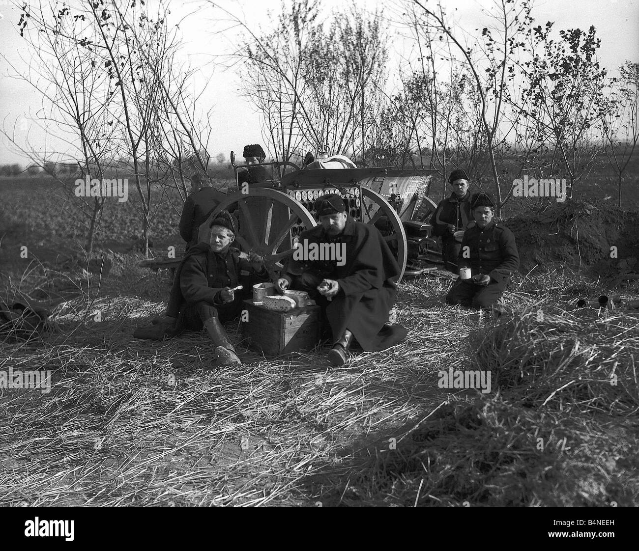 Belgian artillerymen having a meal by their gun during World War One ...