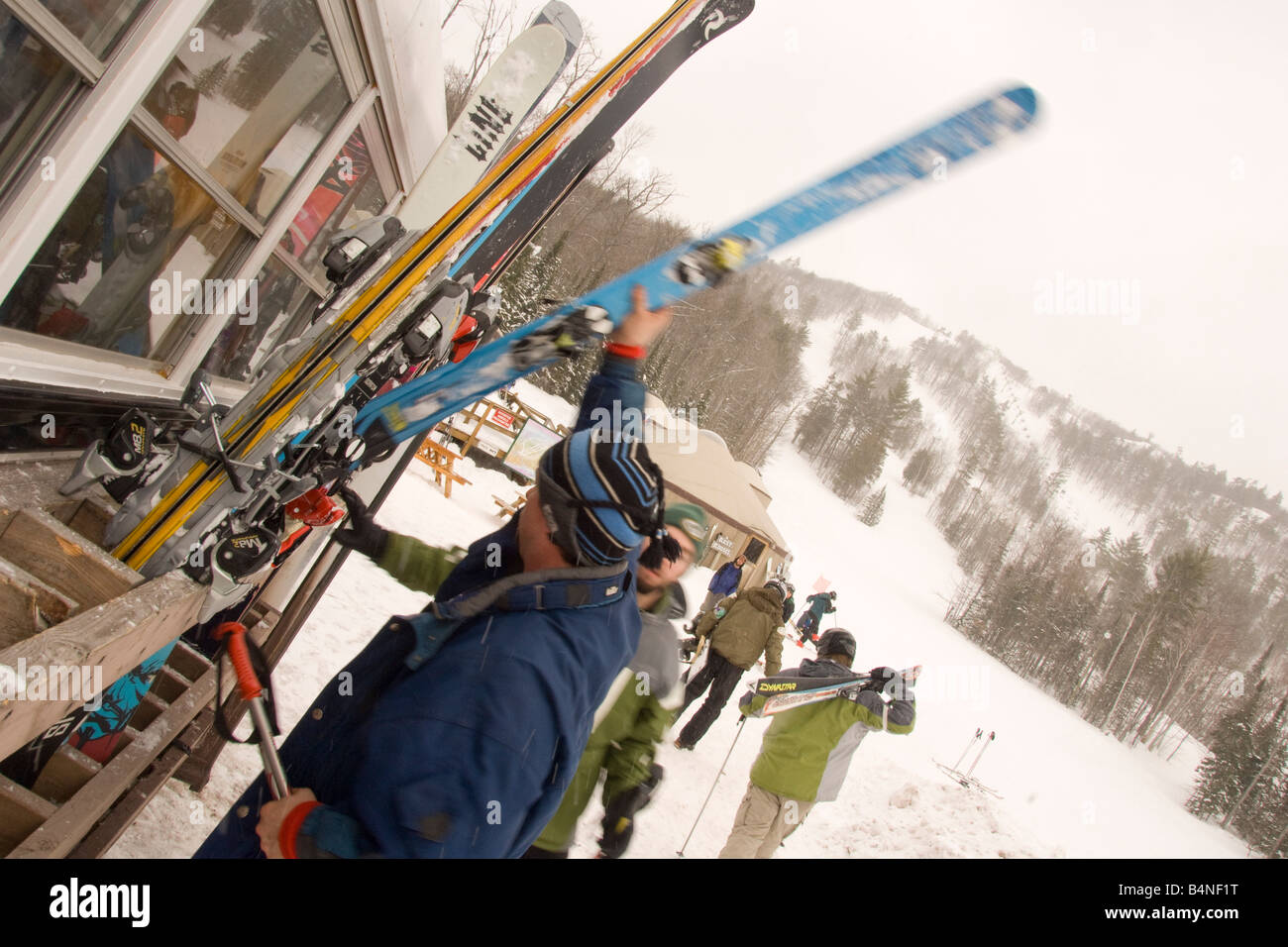 Skiers and snowboarders use the shuttle bus at Mount Bohemia ski resort ...