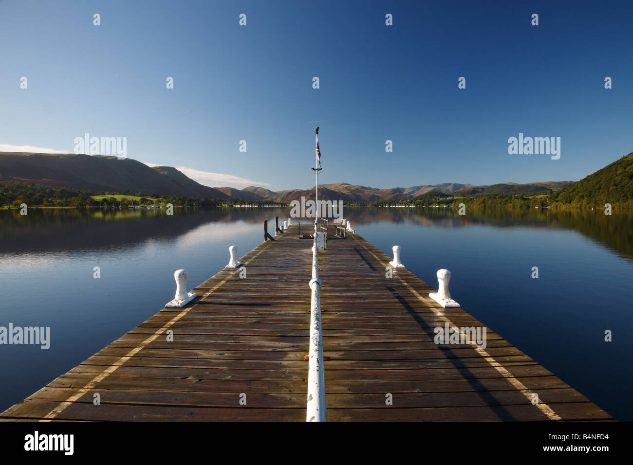 Pier stretching out to the horizon. Pooley Bridge, Ullswater, Lake ...