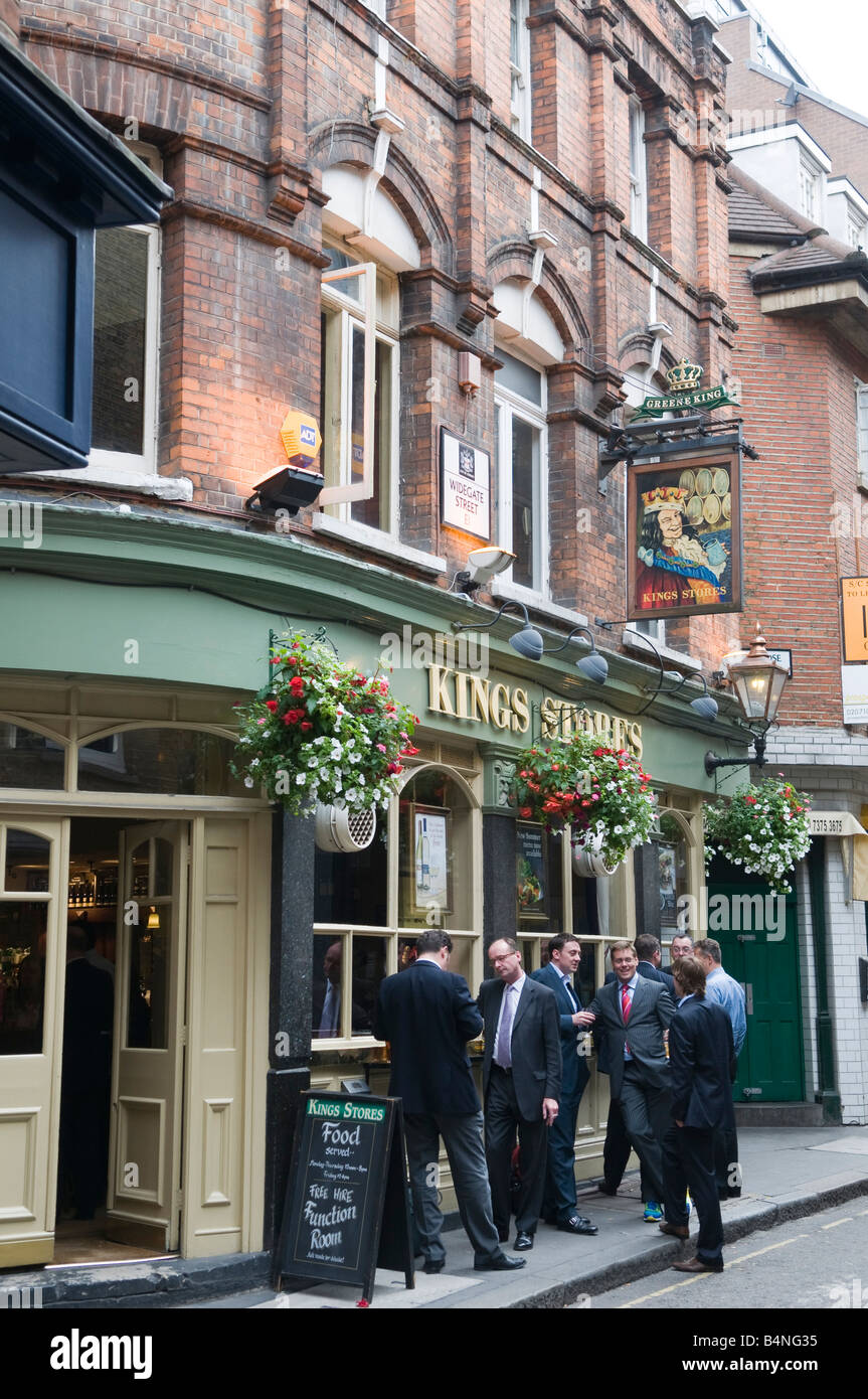 People drinking on street outside pub in Bishopsgate area London ...