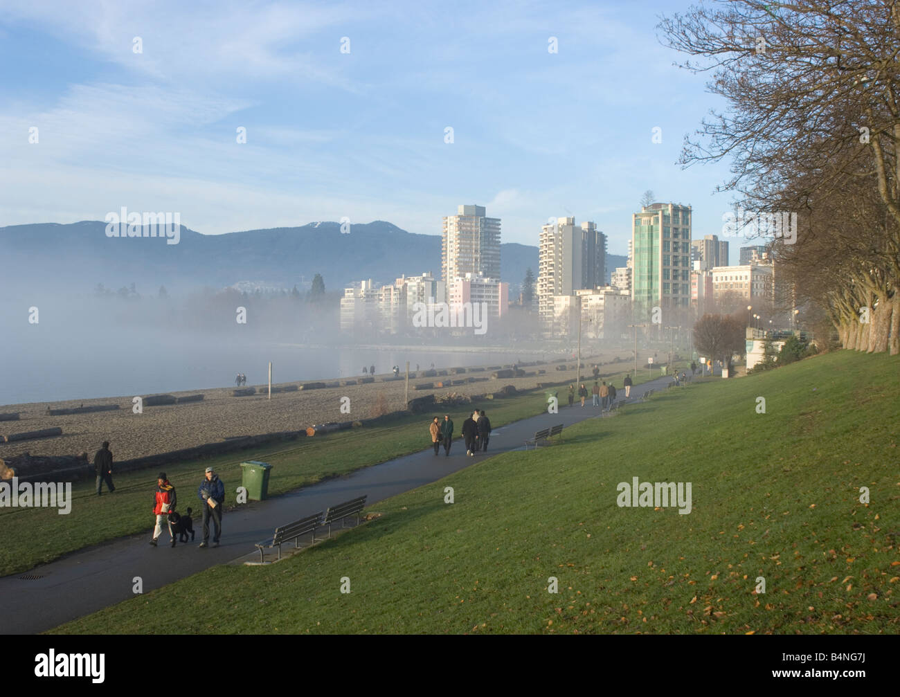 people strolling on English Bay sea wall promenade West End Vancouver ...
