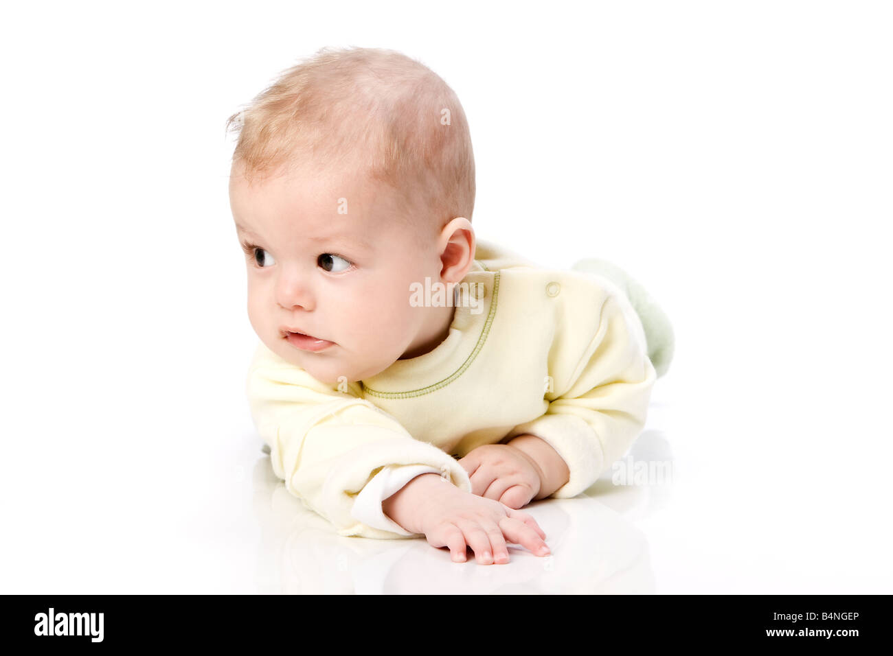 Laying baby surprised facial expression Stock Photo - Alamy