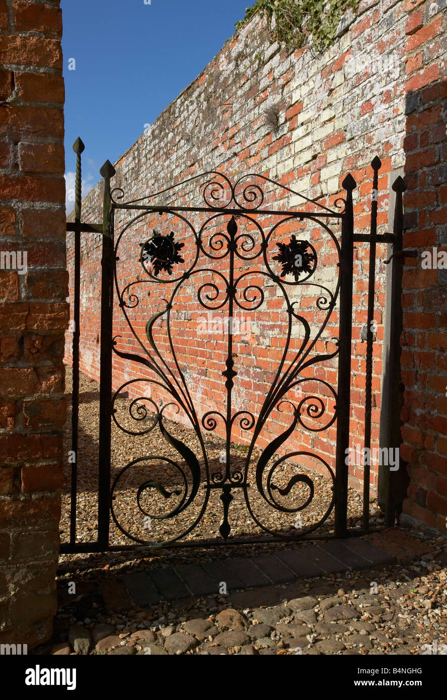 Beautiful intricate old cast wrought iron gate into walled garden at ...