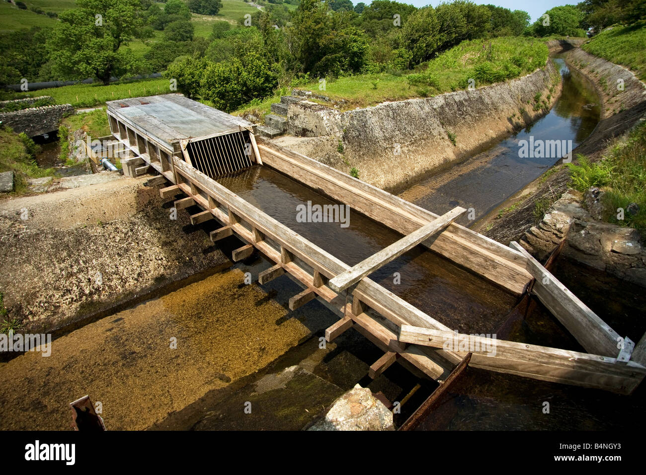 Coedty compensator or flume controlling amount of water from stream ...