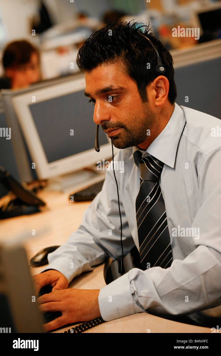 Call centre operator using telephone hi-res stock photography and ...