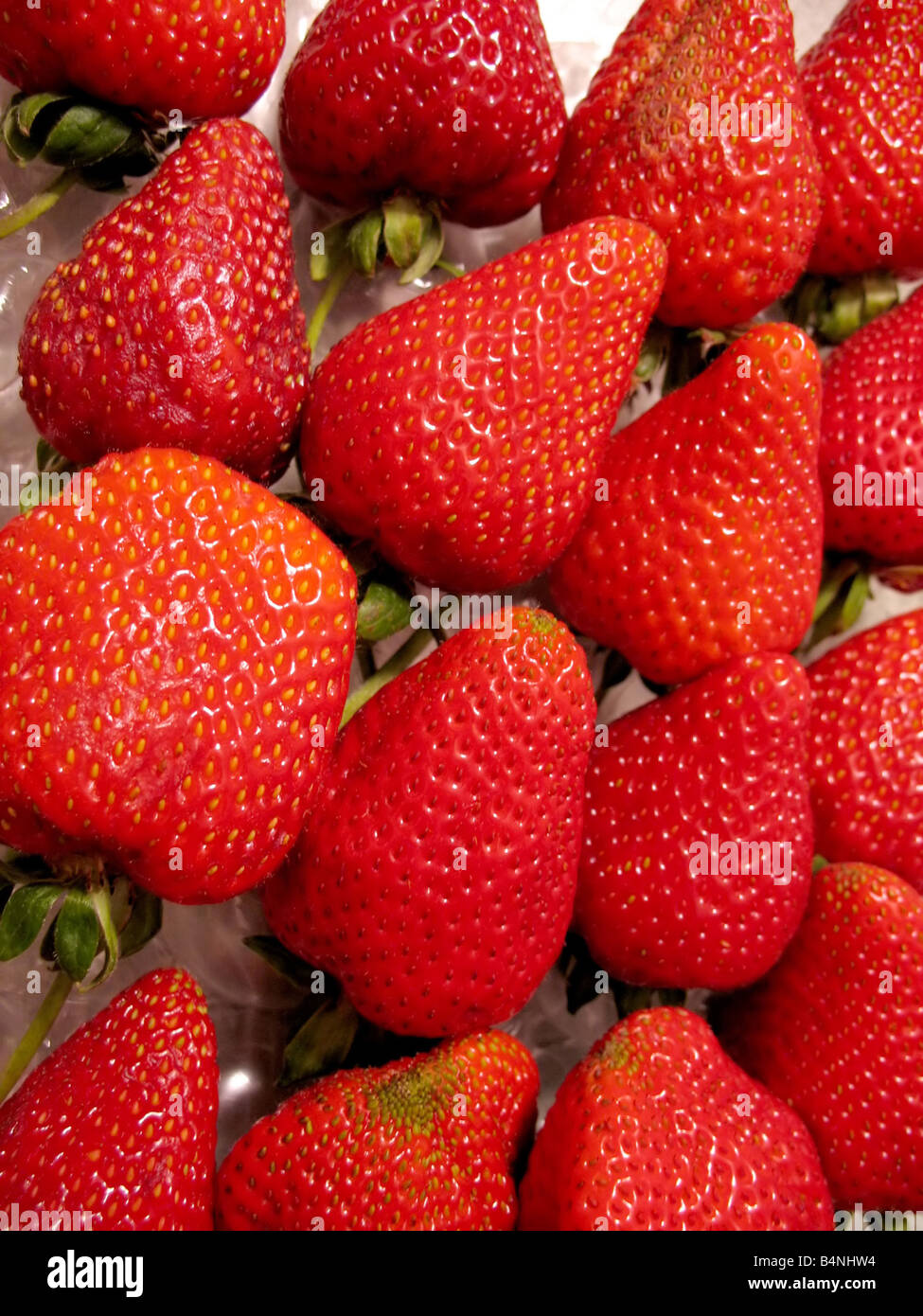 An arrangement of some bright red strawberries Stock Photo - Alamy
