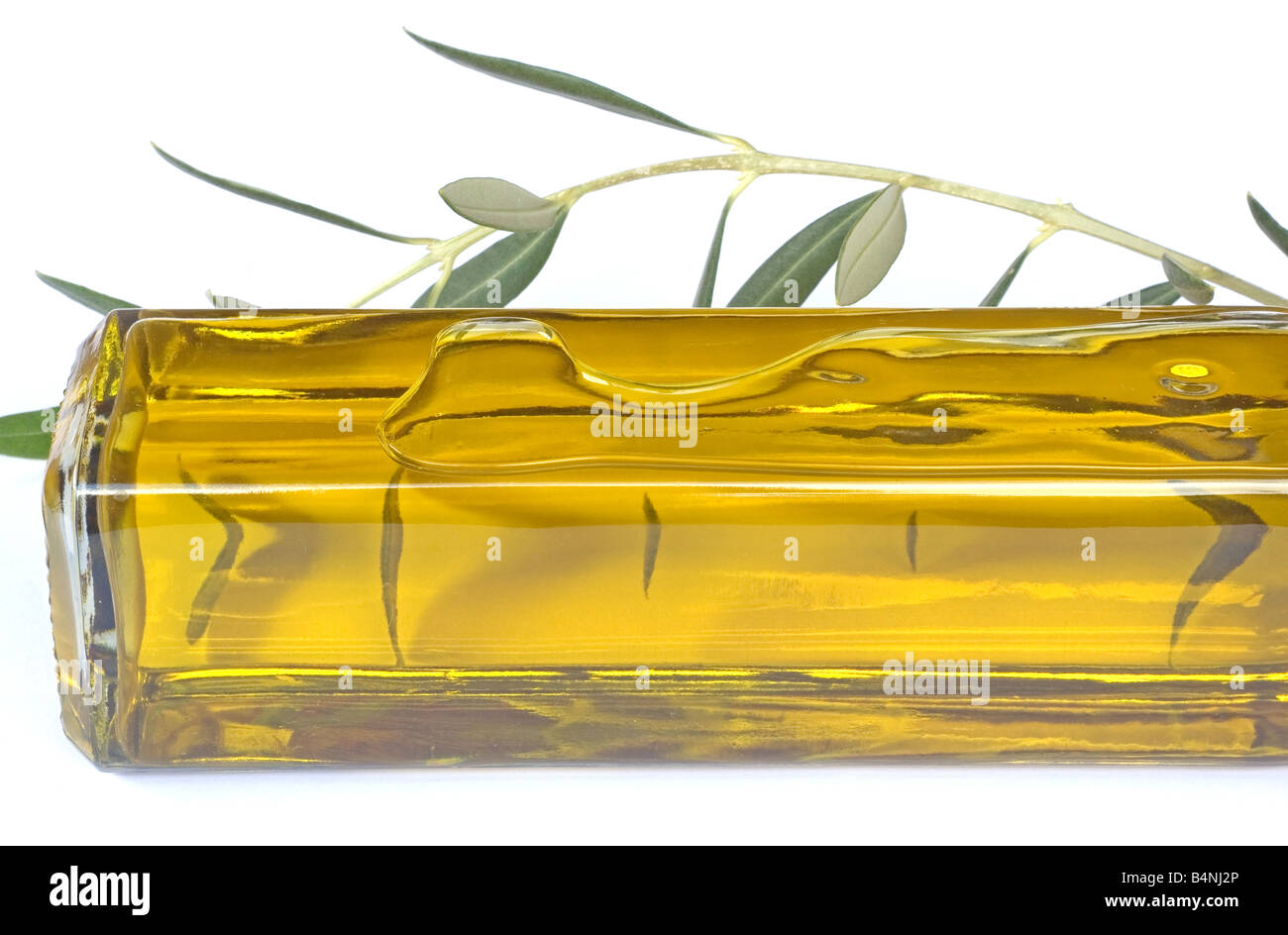 Olive oil and leaves on white background Stock Photo - Alamy
